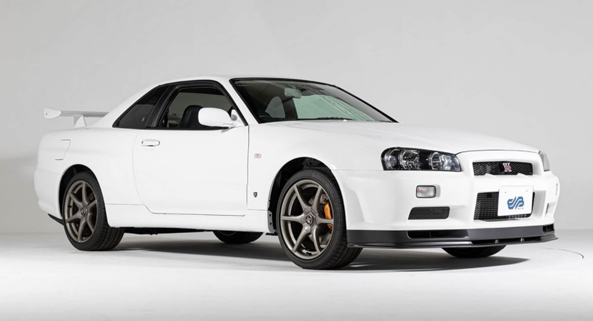 【文章】2002日产GT-R R34 V-Spec II Nür 6,050万日元成交：此车718辆之一，159辆白色之一，搭载 ...